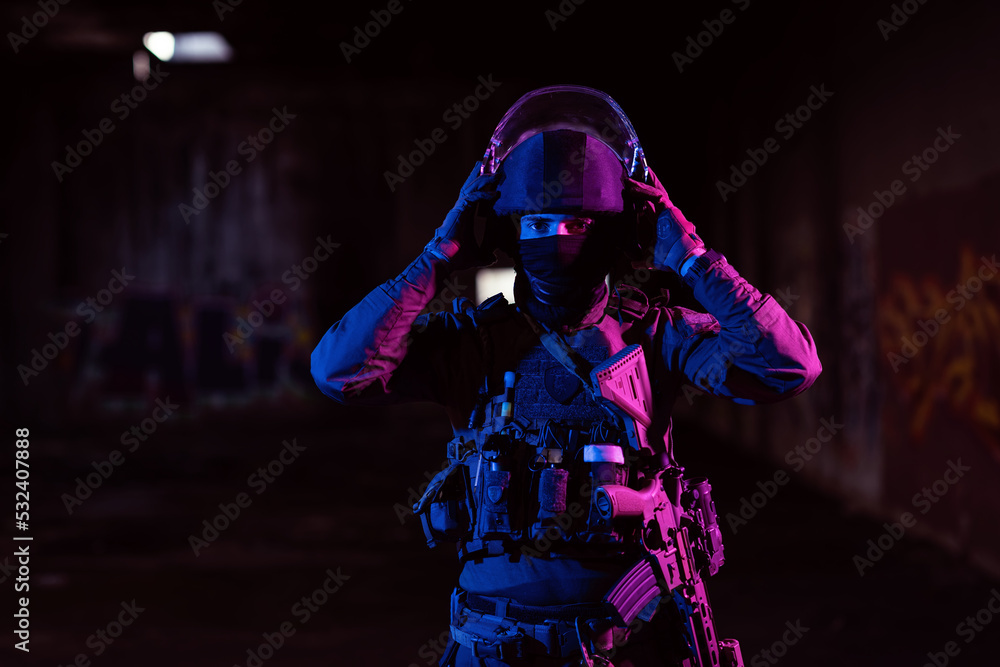 Army soldier in Combat Uniforms with an assault rifle and combat helmet ...