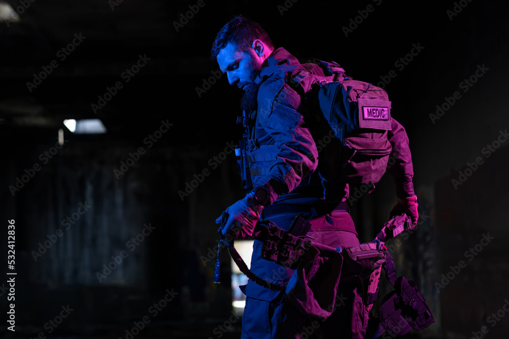 Army soldier in Combat Uniforms with an assault rifle and combat helmet ...
