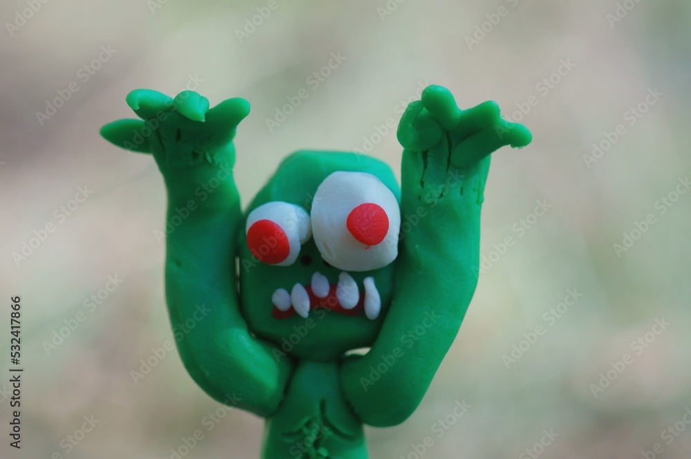 The zombie figurine is trying to scare. Funny monster made of ...
