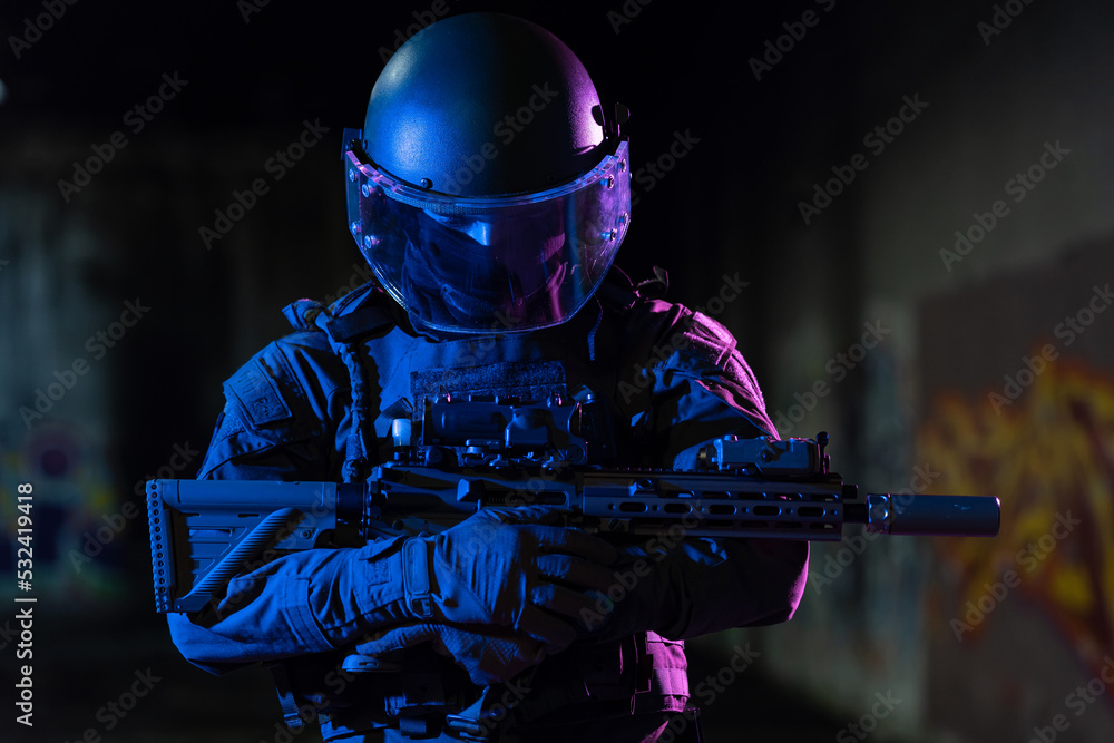 Army soldier in Combat Uniforms with an assault rifle and combat helmet ...