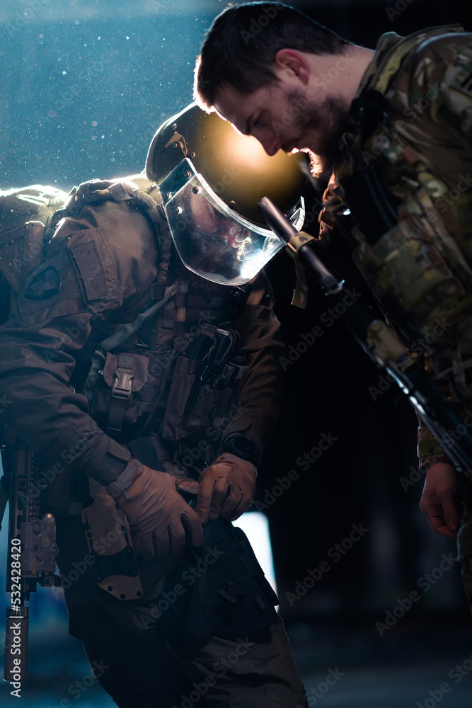 Modern warfare soldiers in dark with combat ammunition and weapons in ...