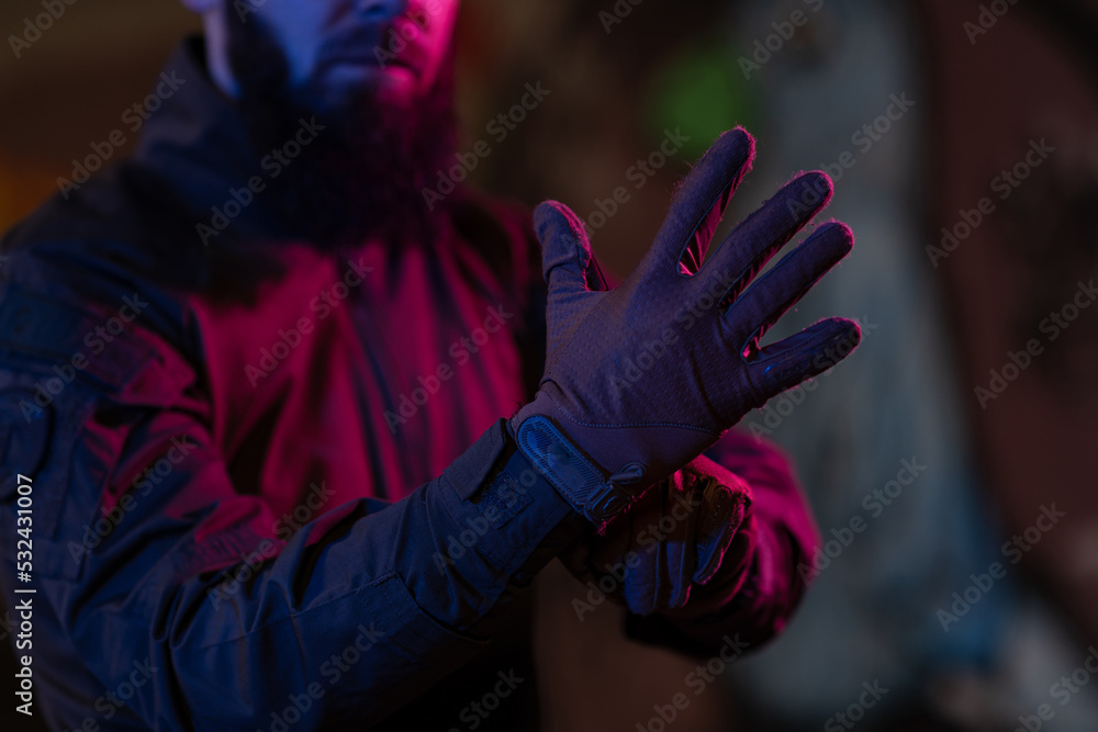 Photo of a fully equipped soldier in black armor tactical vest and ...