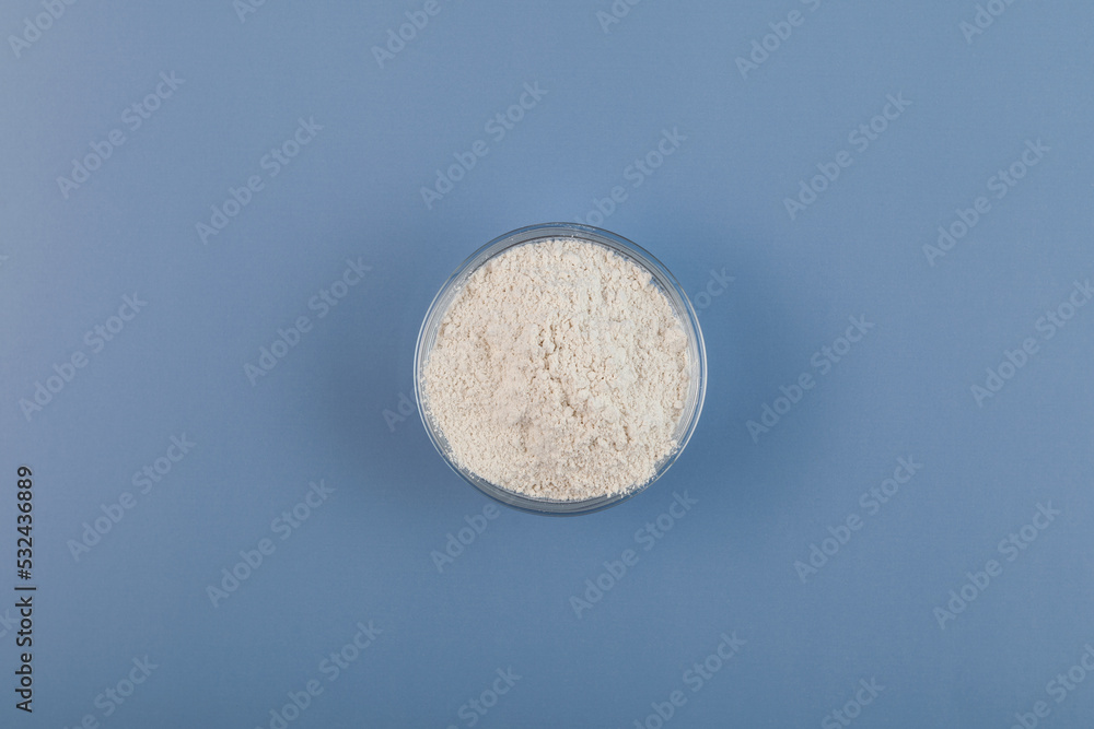 Titanium dioxide, white chemical powder, TiO2 in glass bowl, top view ...