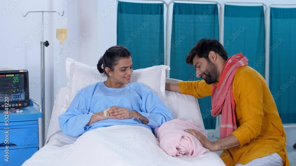 Newborn baby in a hospital - Indian father with his newborn baby and ...