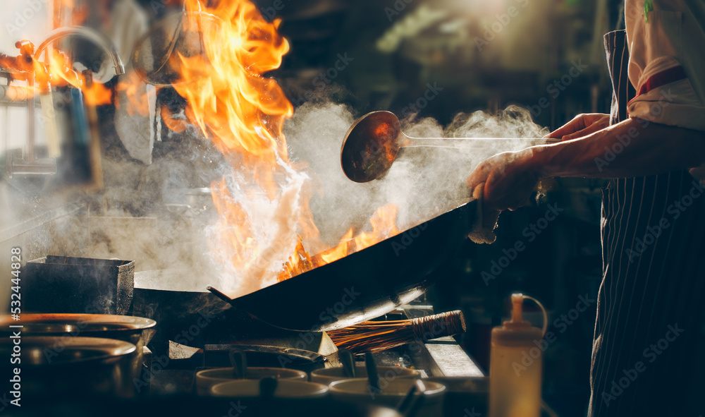 Chef stir fry cooking Stock Photo | Adobe Stock