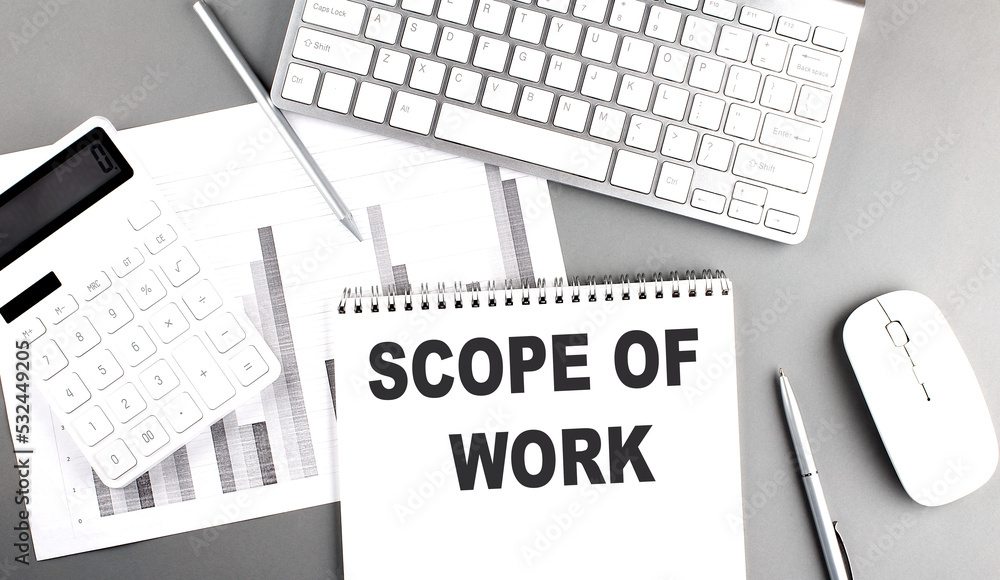 SCOPE OF WORK text written on notebook on grey background with chart ...