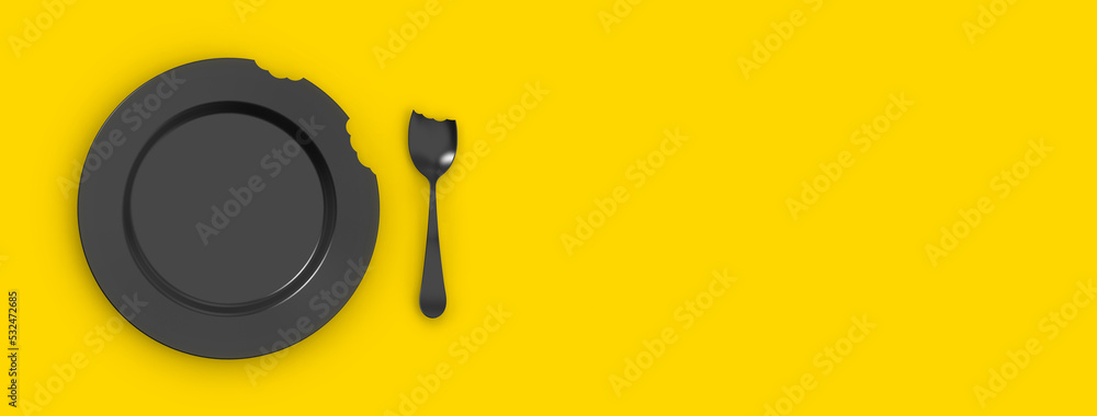 bitten black plate on a yellow background. Next to the plate is a black ...