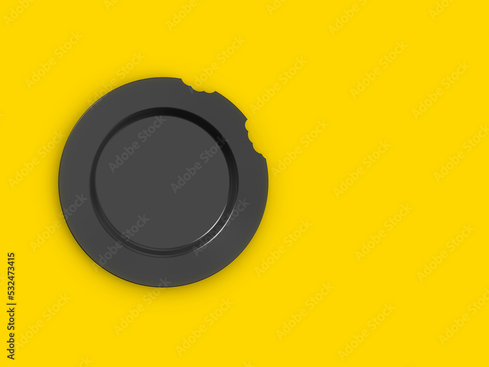 bitten black plate on a yellow background. Teeth marks. Food crisis ...