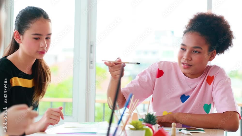 Diversity group of cute kids and teenage painting with water colour in ...