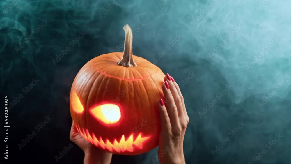 Steaming pumpkin laughing evilly - head of jack-o-lantern with carved ...