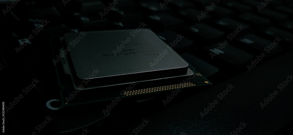 Image of cpu processor chip on black keyboard background. Equipment and ...