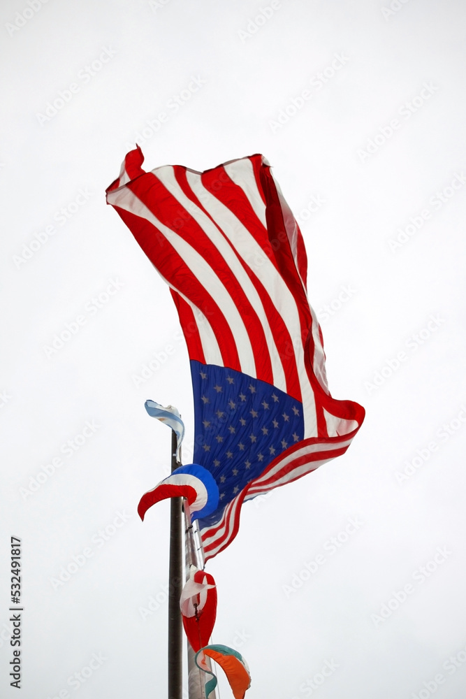 american flag vertical on pole with white background Stock Photo ...