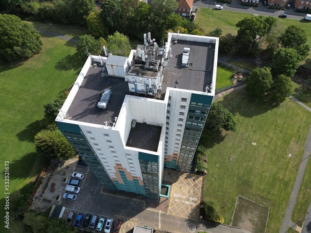 Arial view of suburban 1960s residential tower block with flammable ...