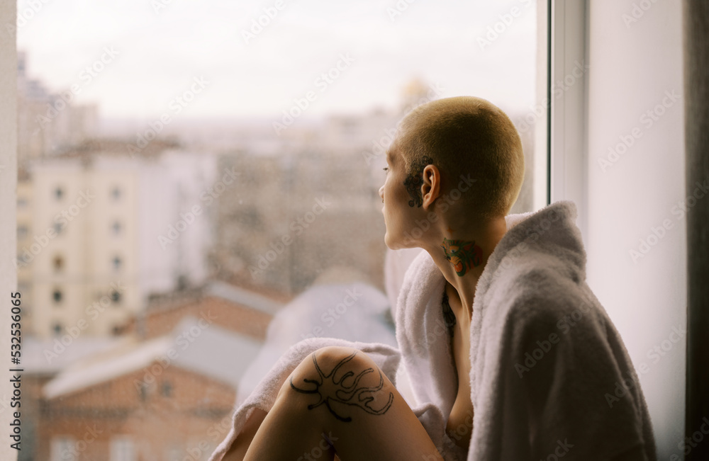 Androgyne woman indoors Stock Photo | Adobe Stock