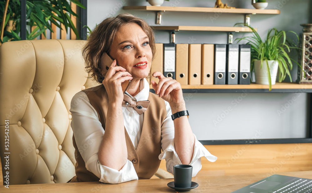 Confident stylish mature middle aged elderly woman in office.Workplace ...