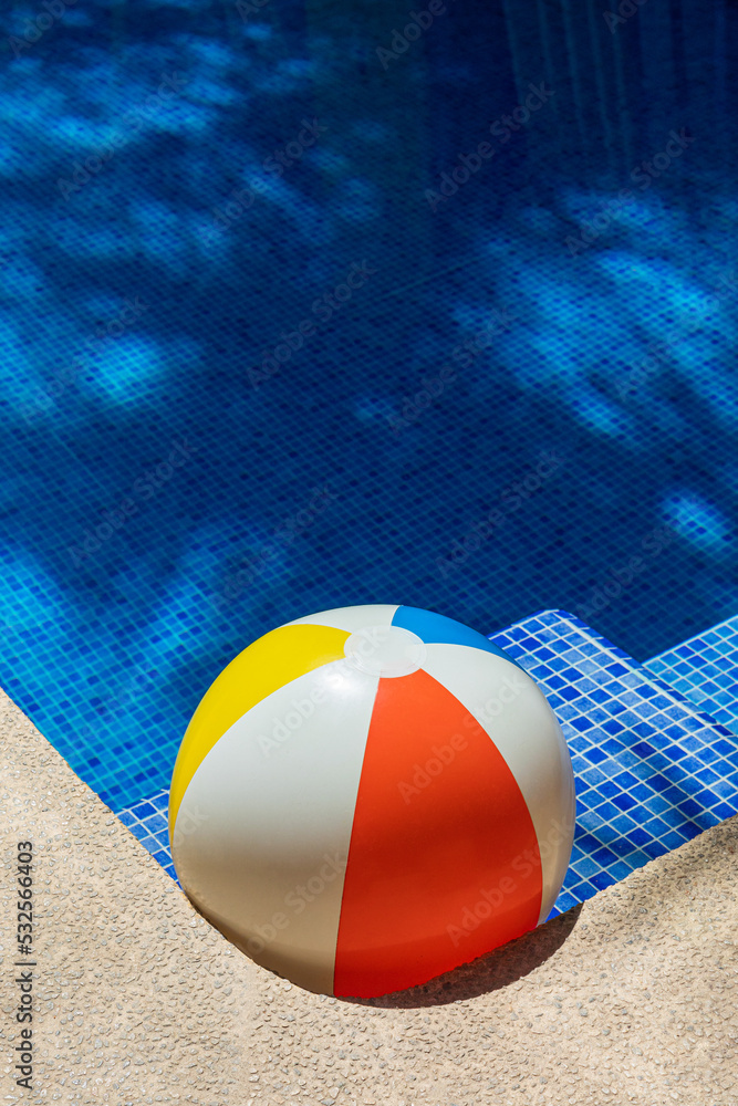 Floating beach ball in a swimming pool with blue water Stock Photo ...