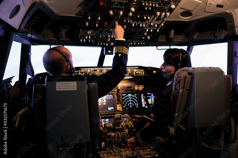 Airliners team flying airplane with dashboard command, using control ...