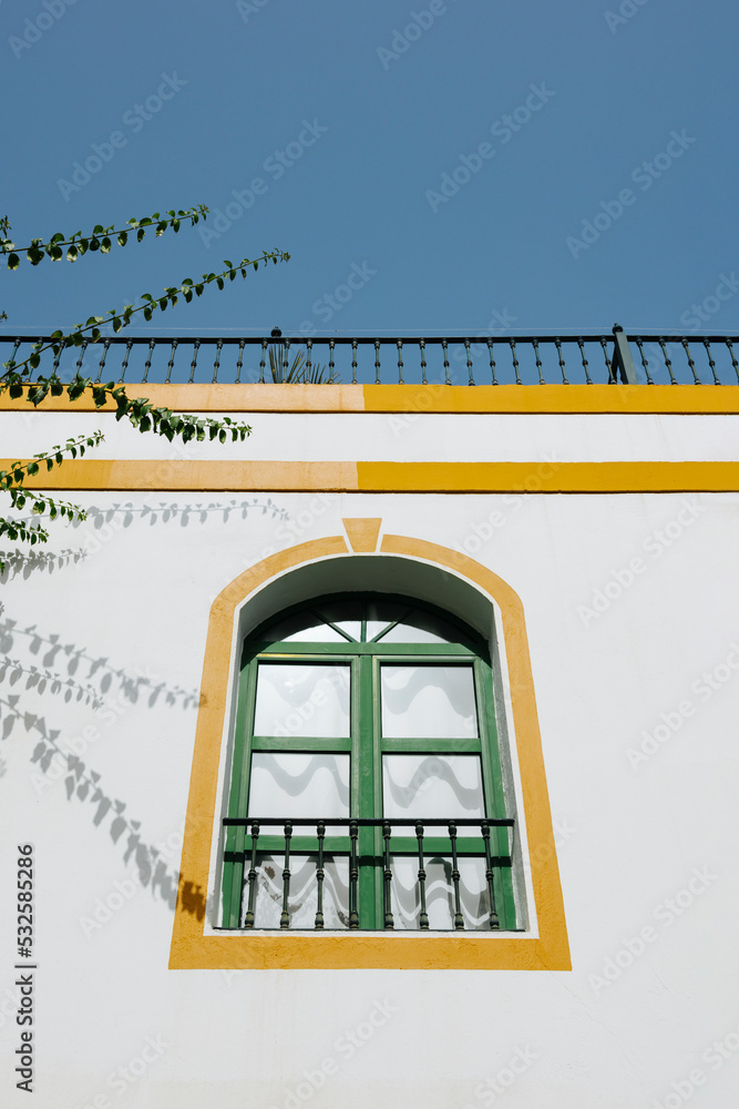 Window of colonial building with arched windows Stock Photo | Adobe Stock