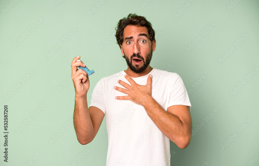 young crazy bearded and expressive man with an asthma inhaler Stock ...