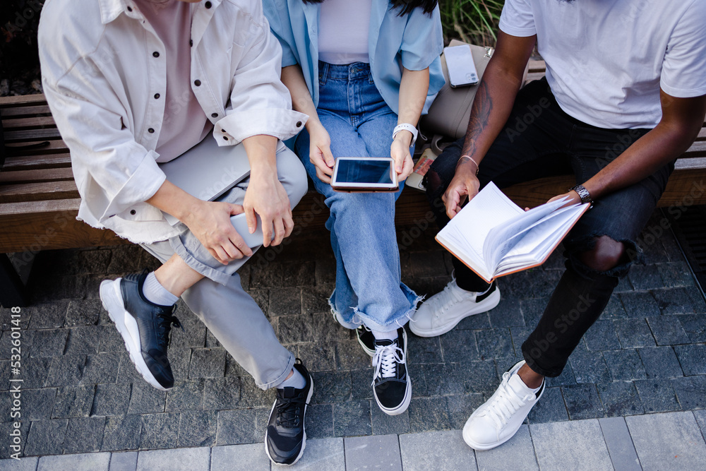 Fellow students doing assignment Stock Photo | Adobe Stock