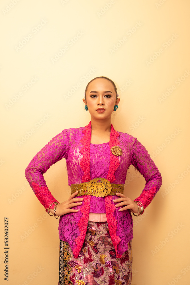 Balinese woman wearing a pink dress called kebaya from Indonesia's ...