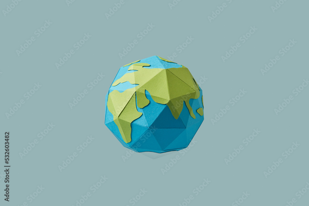 Papercraft Earth planet on gray background. Stock Photo | Adobe Stock