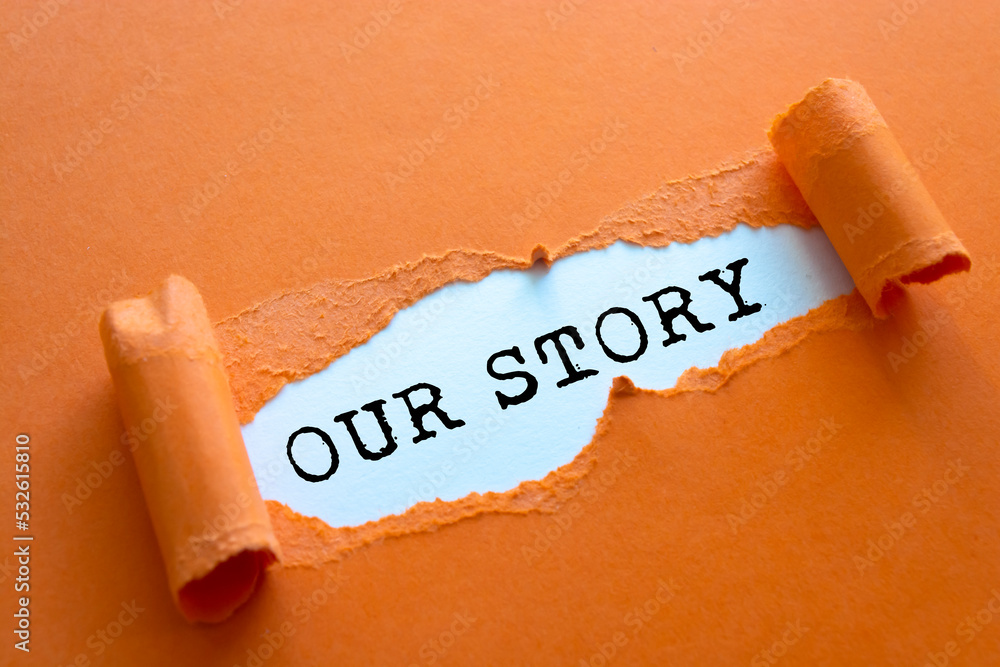 Our story symbol. Words 'Our story' appearing behind torn brown paper ...