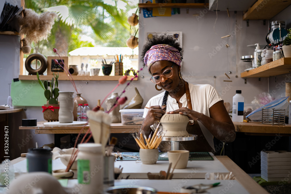 Woman working, creating at her work desk Stock Photo | Adobe Stock