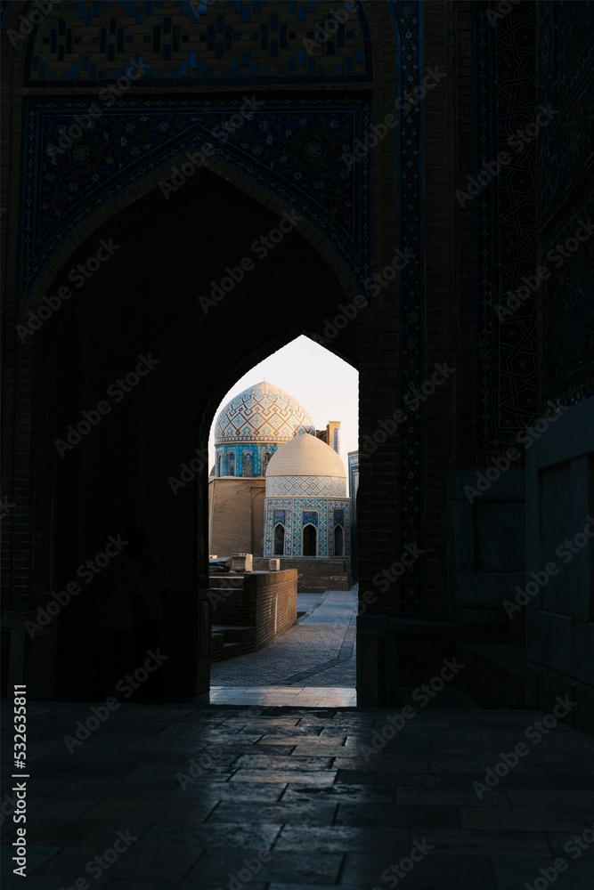 Open door in the dark room leading to the mosque, Samarkand Stock Photo ...