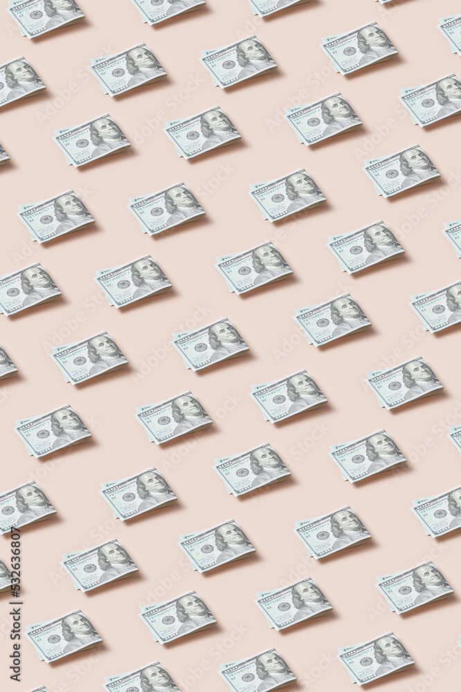 100 dollar bills repeated pattern on beige. Stock Photo | Adobe Stock