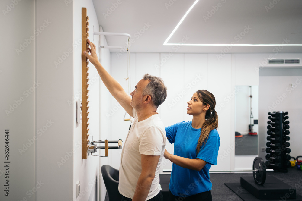 Rehabilitation therapy in a physical therapy gym. Stock Photo | Adobe Stock