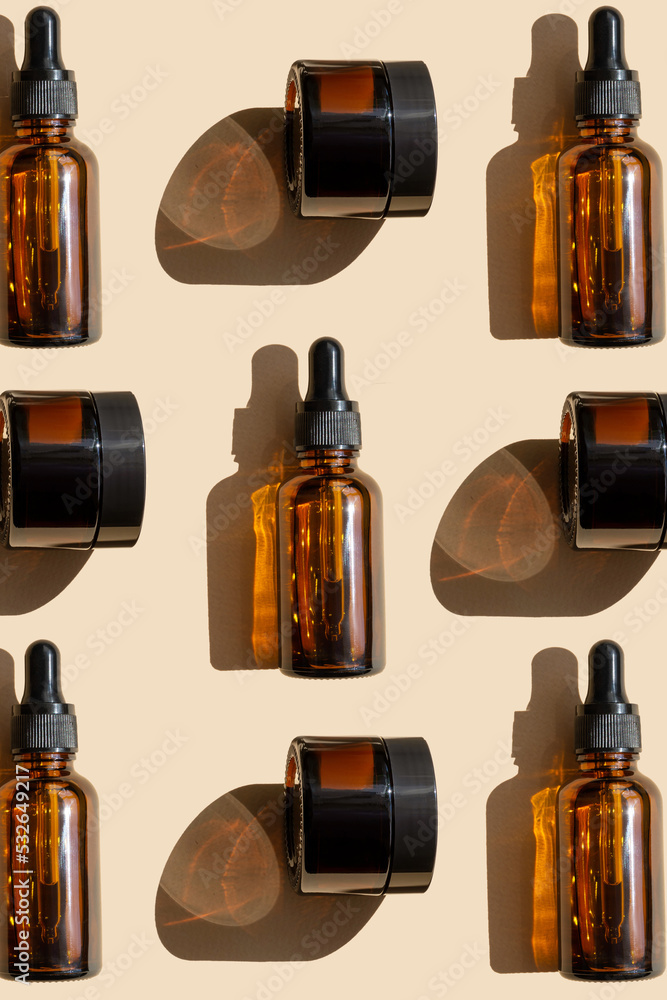Mockup of amber glass bottles and cans are arranged in chaotic manner ...