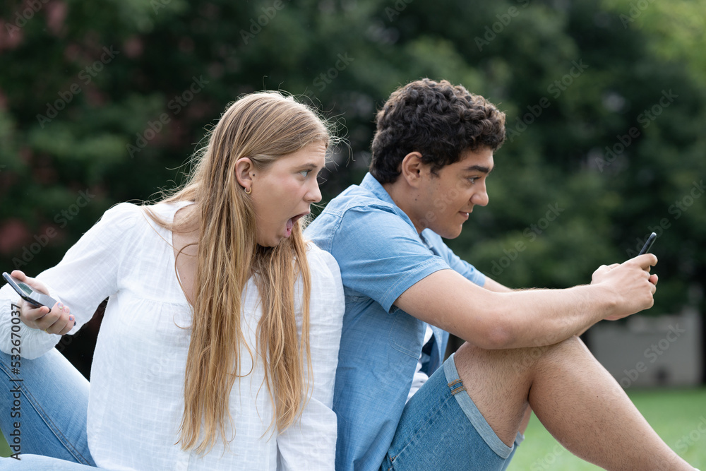 Boy cheating girlfriend on social media and surprised girl watching ...