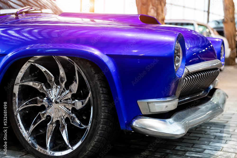 Many classic purple vintage old american cars parked in row at garage ...