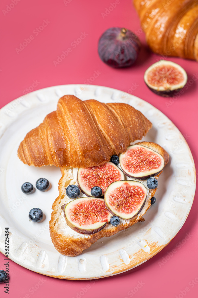 Modern photo on a bright pink background. Croissants with cream cheese ...