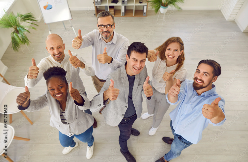 Group of happy colleagues or satisfied customers give recommendation ...