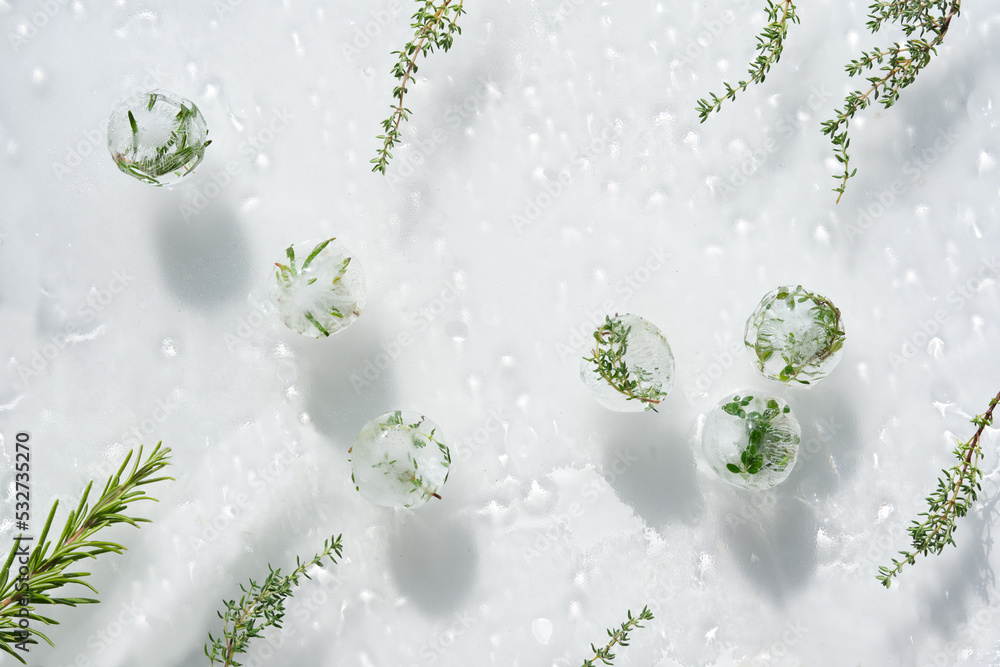 Wet off white water background with melting balls of ice with frozen ...