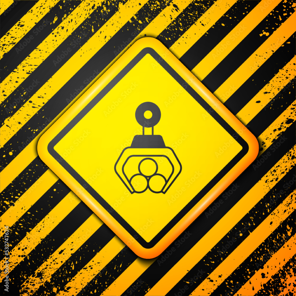 Black Grapple crane grabbed a log icon isolated on yellow background ...