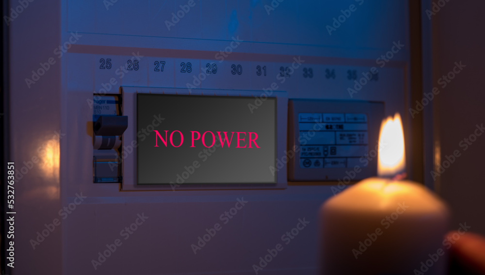Electrical switch box panel with the text "no power" and burning candle ...