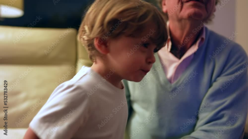 Grandfather embracing grandson. Authentic real life family moment ...