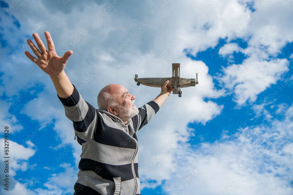 happy retirement. elderly granddad with toy. retired old man outdoor ...