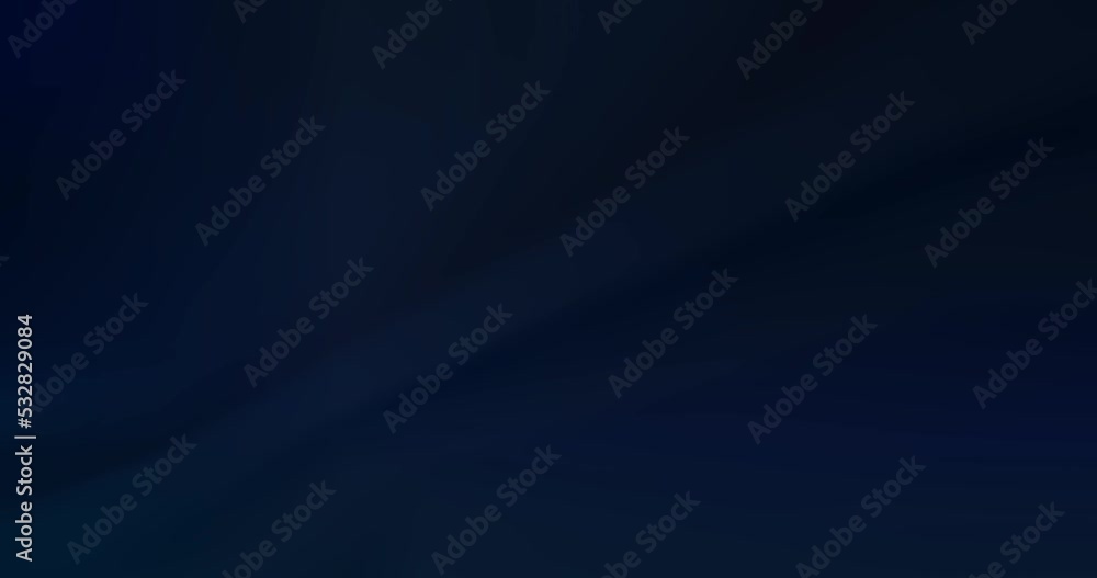 Rays of blue and white light come out of the lower left corner of the ...