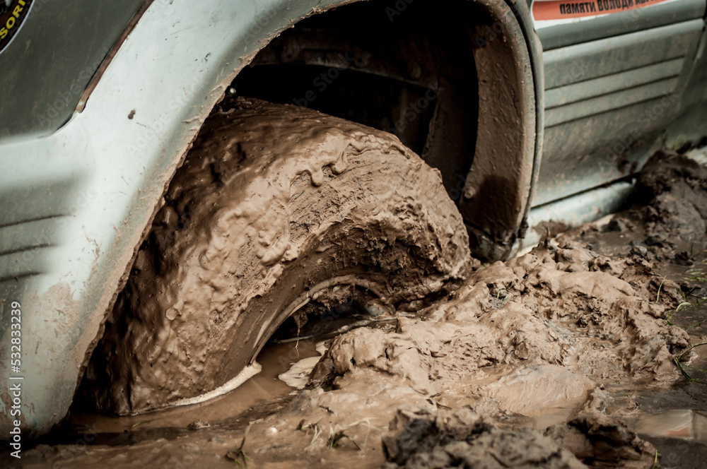 Car wheel stuck in mud, motorsport, mud tire testing. Off-road driving ...