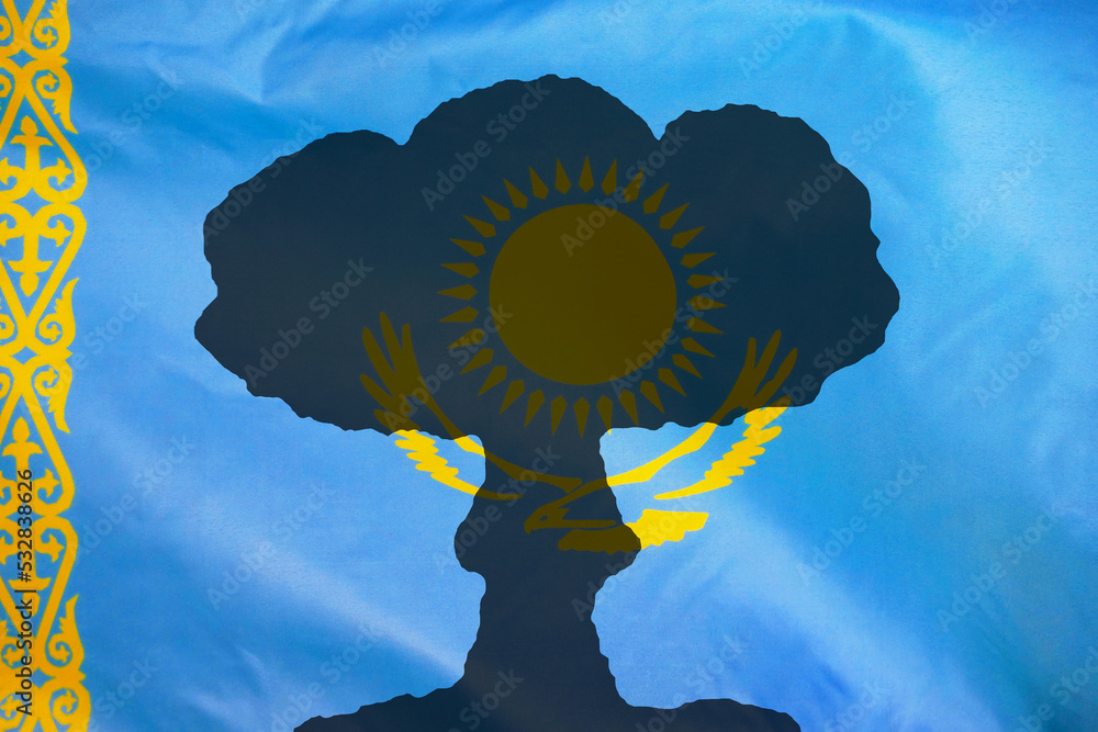 Atomic bomb explosion mushroom on Kazakhstan flag background. Nuclear ...