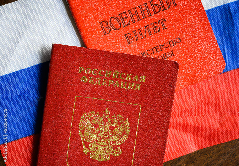 Russian passport, Certificate of Russia serviceman and flag on table ...