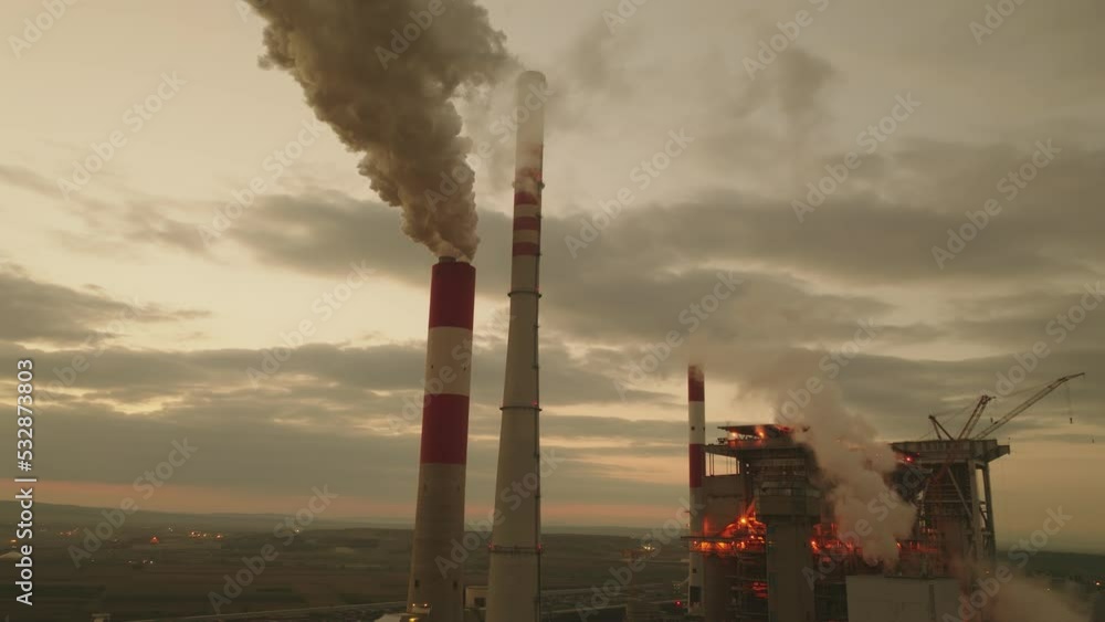 Metallurgical plant with smoke. Evening background of industrial ...
