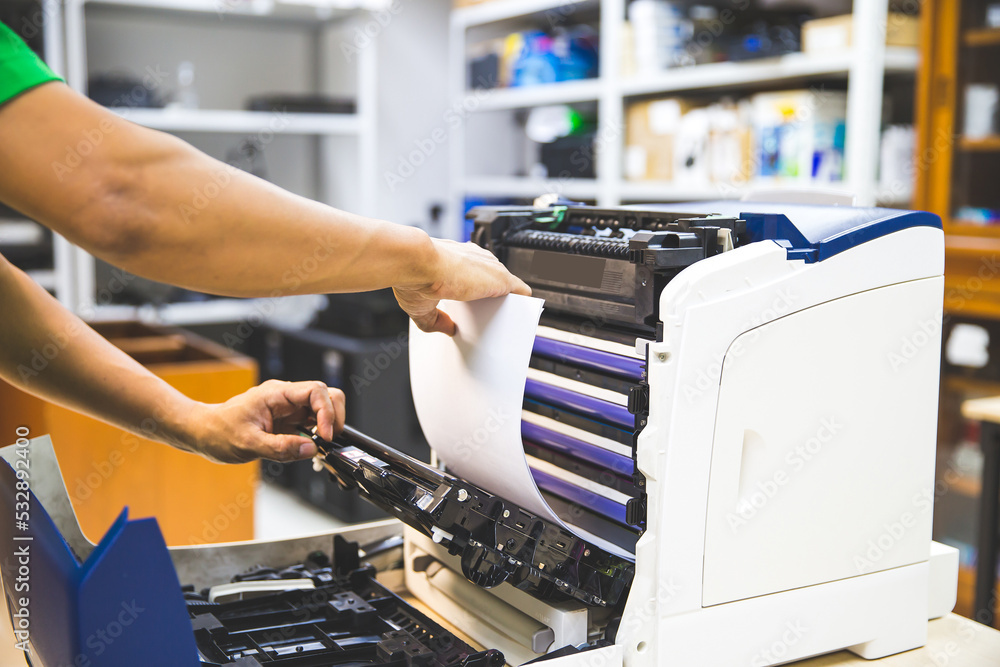 Technician hand open cover photocopier or photocopy to fix copier paper ...