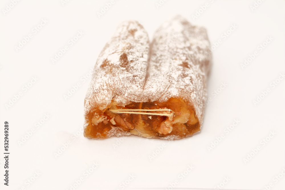 Arabian Egyptian taffy stuffed with walnuts, Eastern candy made as a ...