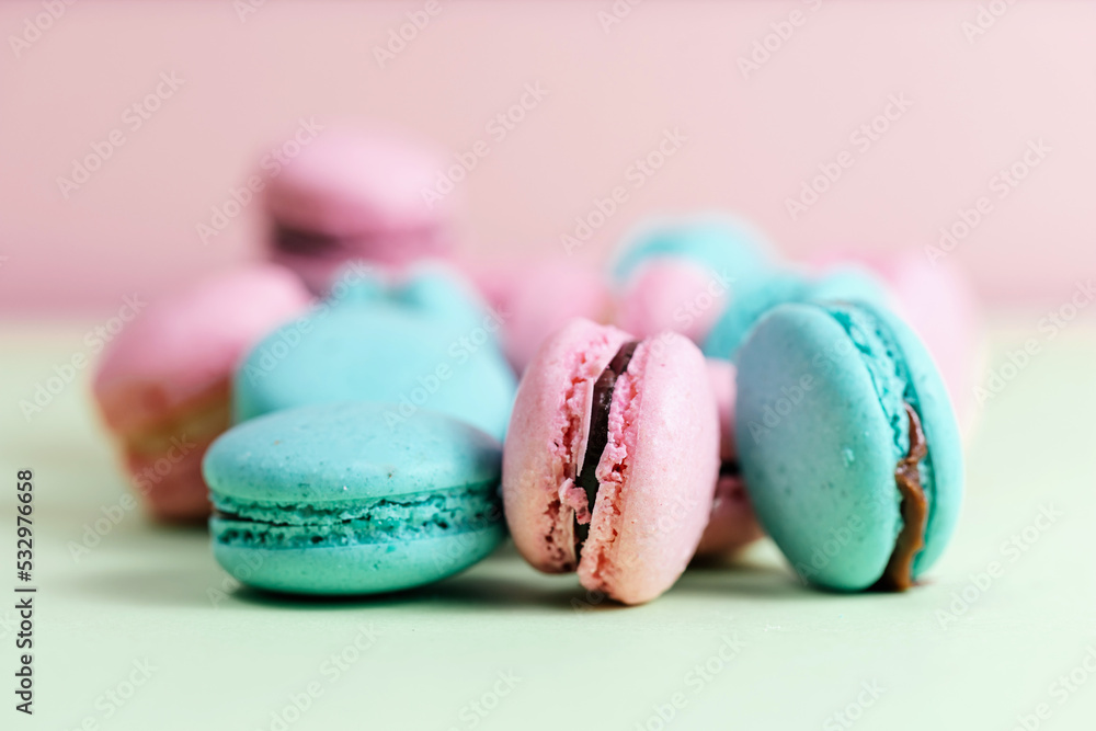 Close-up of macarons cakes of different colors in pastel color ...