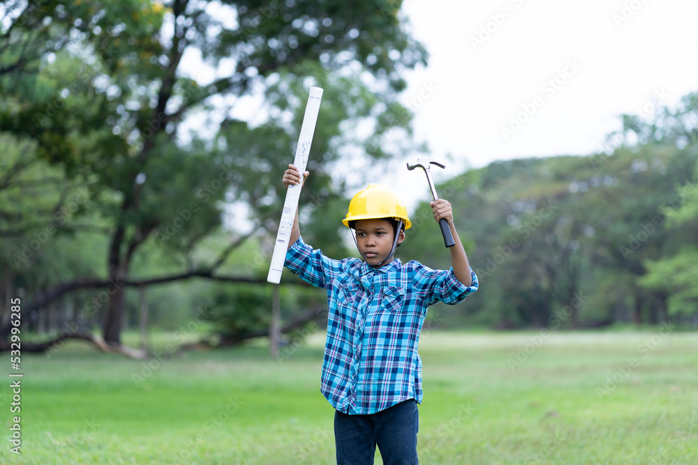 African American child boy in engineering holding construction ...